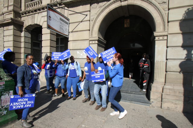 DA members picket outside the town hall - The Rep